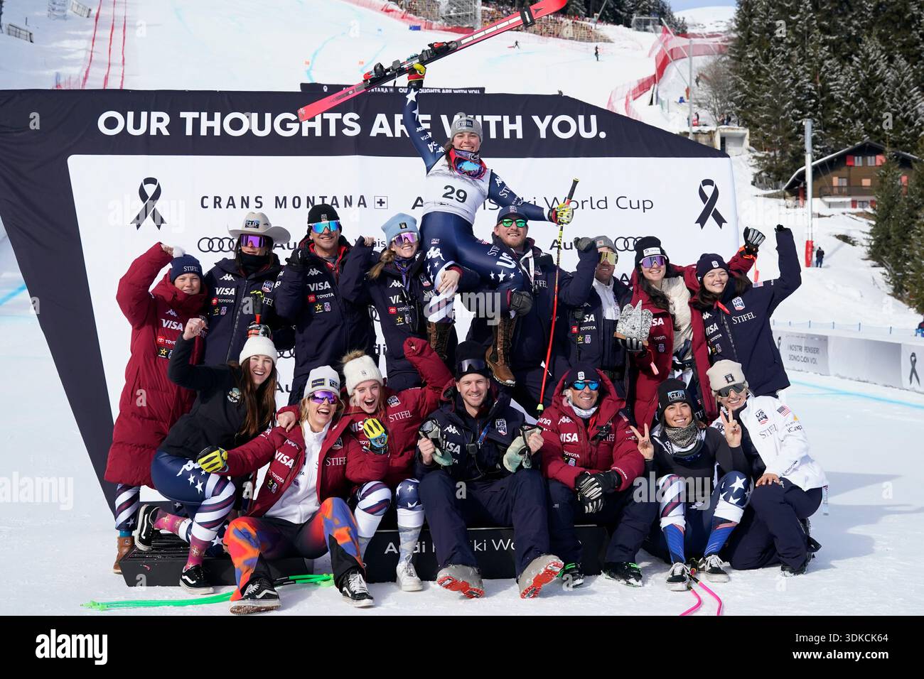 United States' Breezy Johnson, top center, celebrates with the team ...