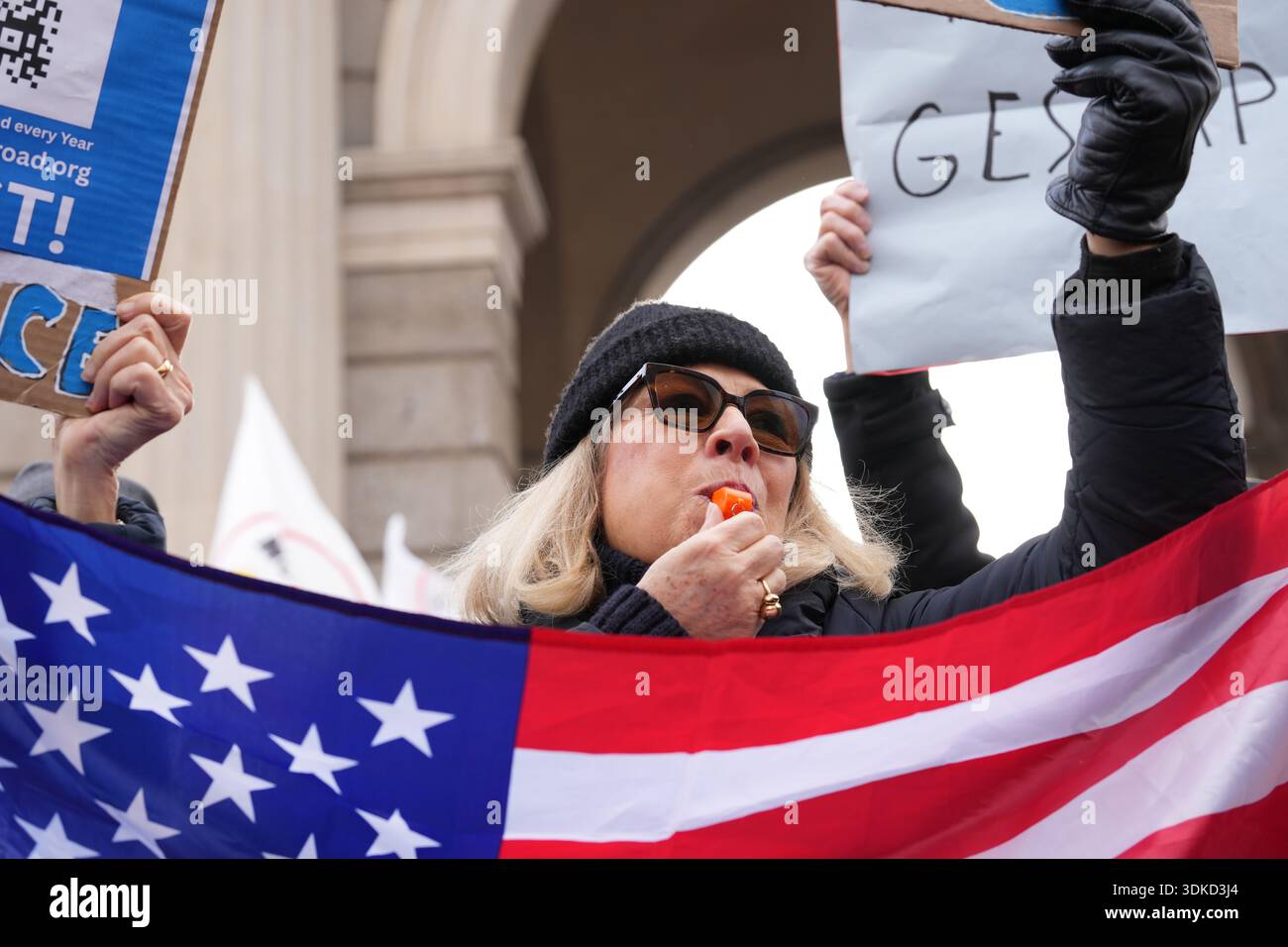 A person blows a whistle, during an Anti-ICE demonstration, ahead of ...