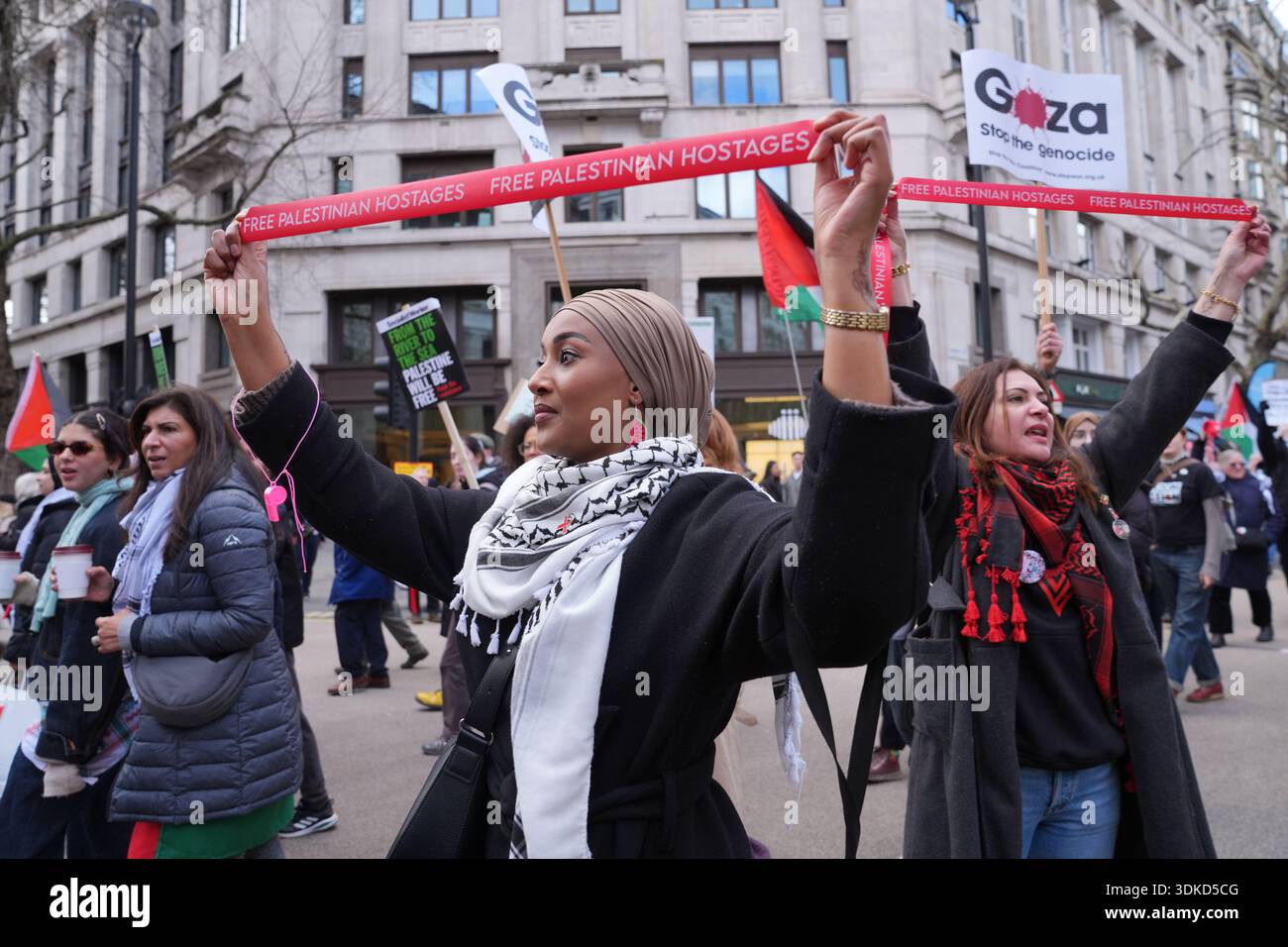 People take part in a Palestine Coalition march in central London ...