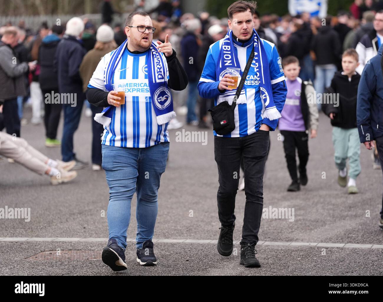 Brighton and Hove Albion fans arrive ahead of the Premier League match ...