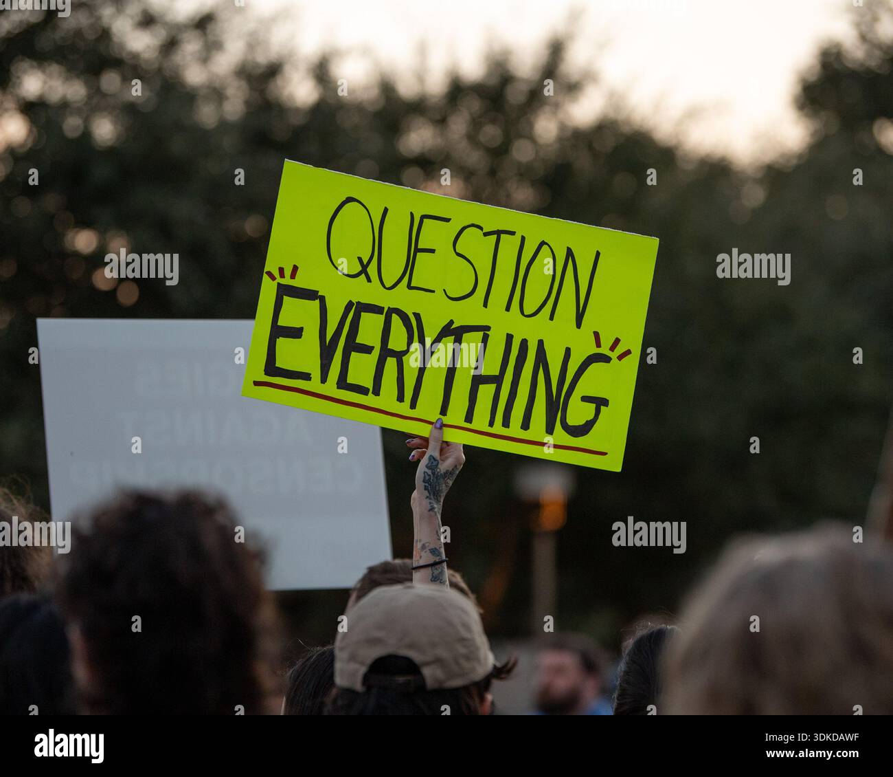 Demonstrators gather and hold signs in Texas A&M's Academic Plaza ...