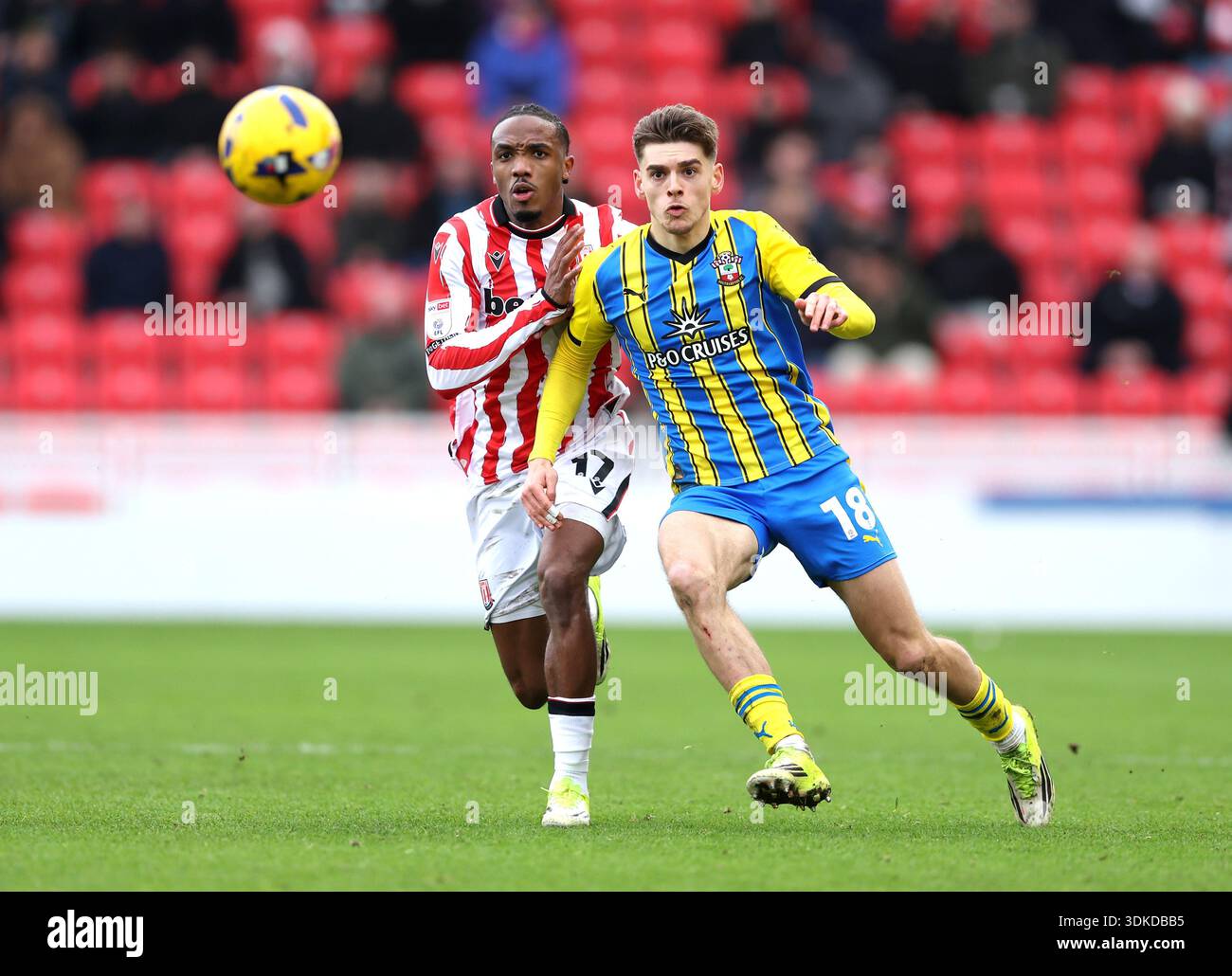 Stoke City's Eric Bocat (left) and Southampton's Tom Fellows battle for ...