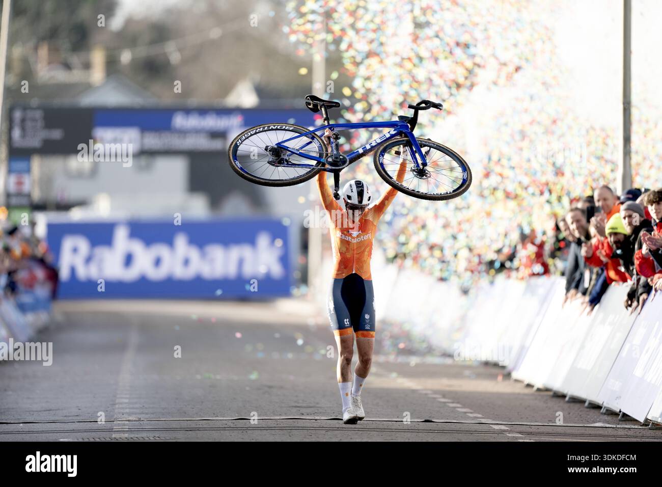 Dutch Lucinda Brand celebrates as she crosses the finish line carrying ...