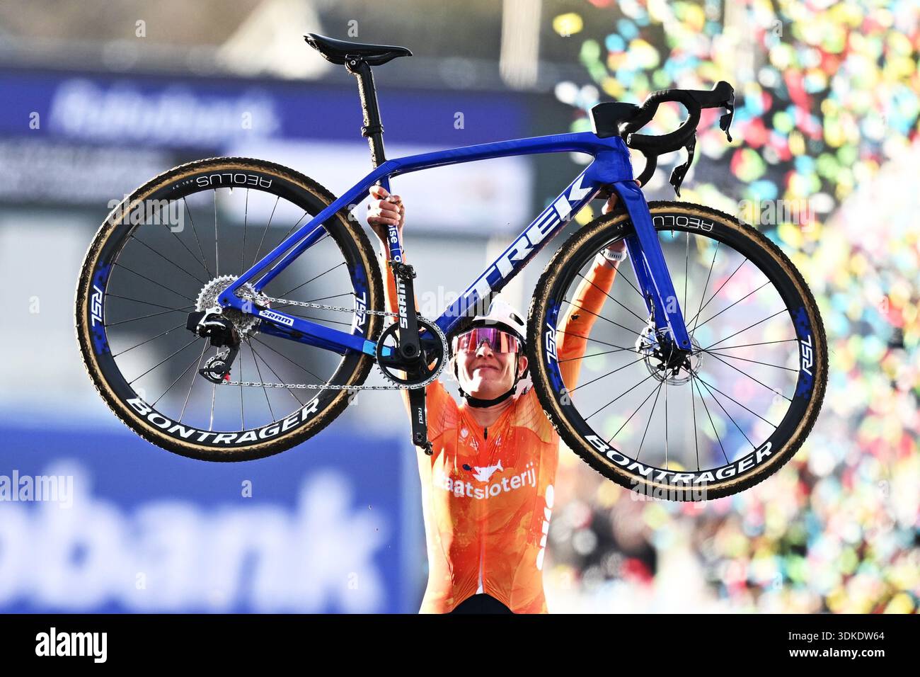 Dutch Lucinda Brand celebrates as she crosses the finish line carrying ...