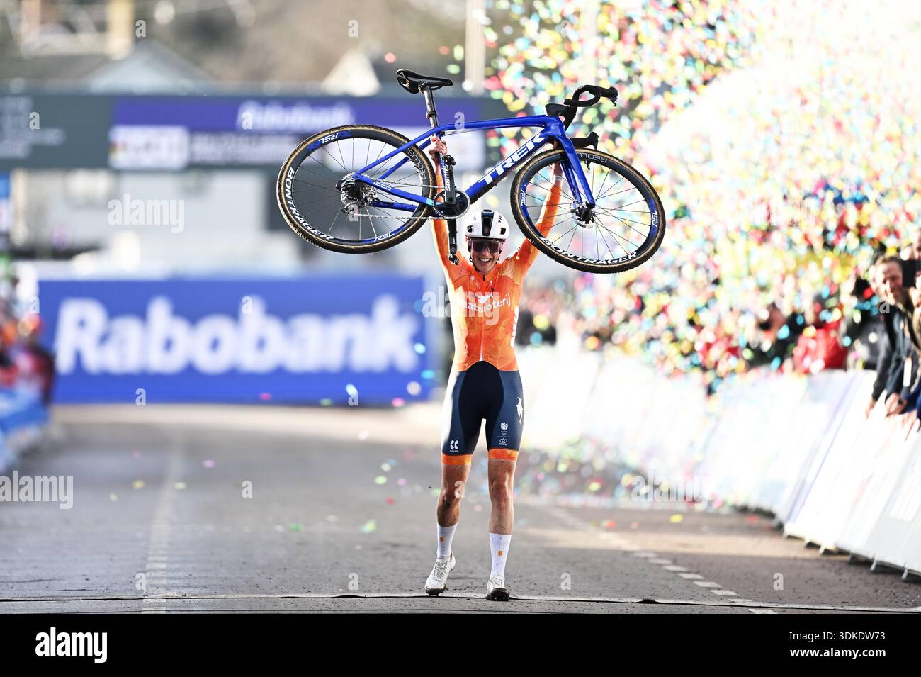 Dutch Lucinda Brand celebrates as she crosses the finish line carrying ...