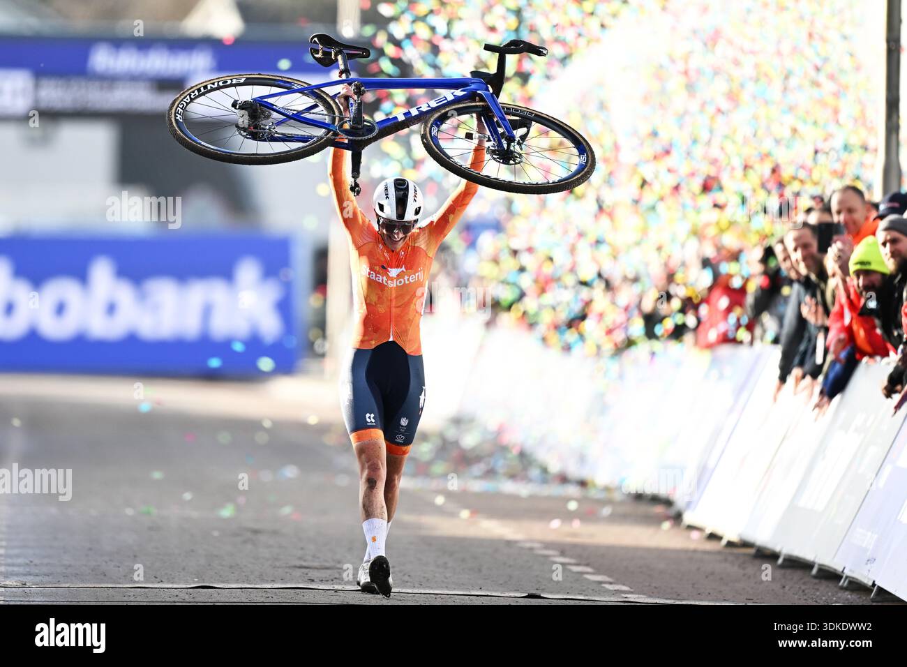 Dutch Lucinda Brand celebrates as she crosses the finish line carrying ...