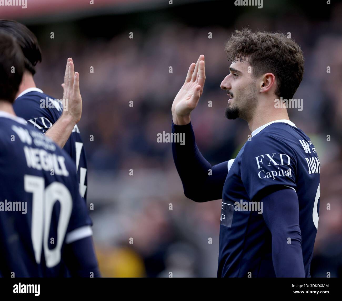 Millwall's Mihailo Ivanovic high fives a teammate after scoring their ...