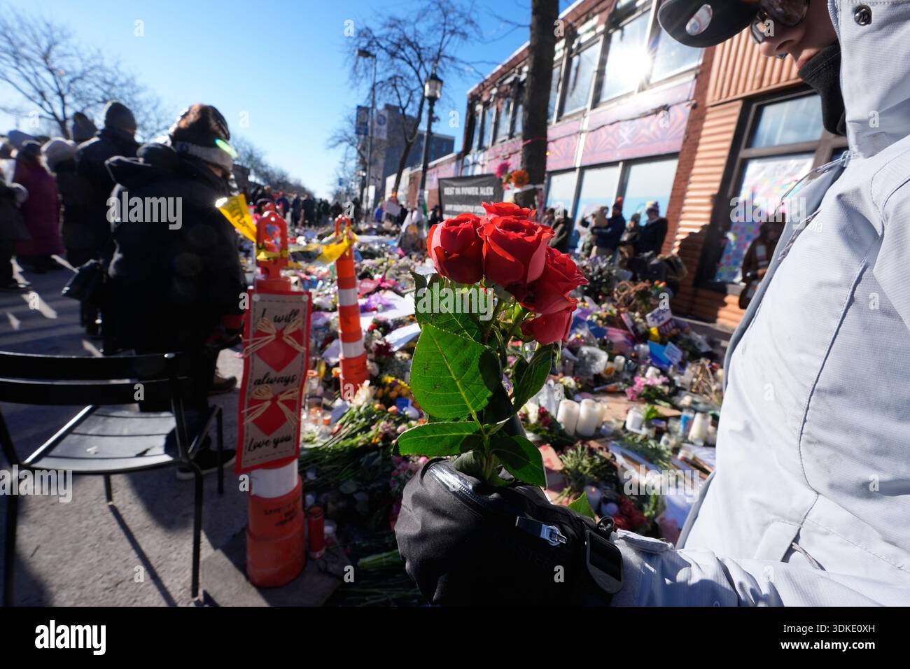 People gather around a memorial site for Alex Pretti on Saturday, Jan ...