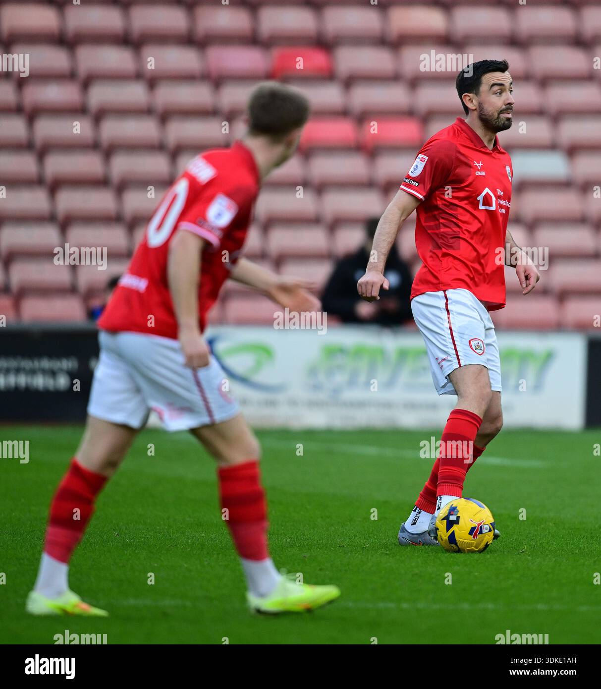 Barnsley's Eoghan O'Connell looks to play the ball forward in the match ...