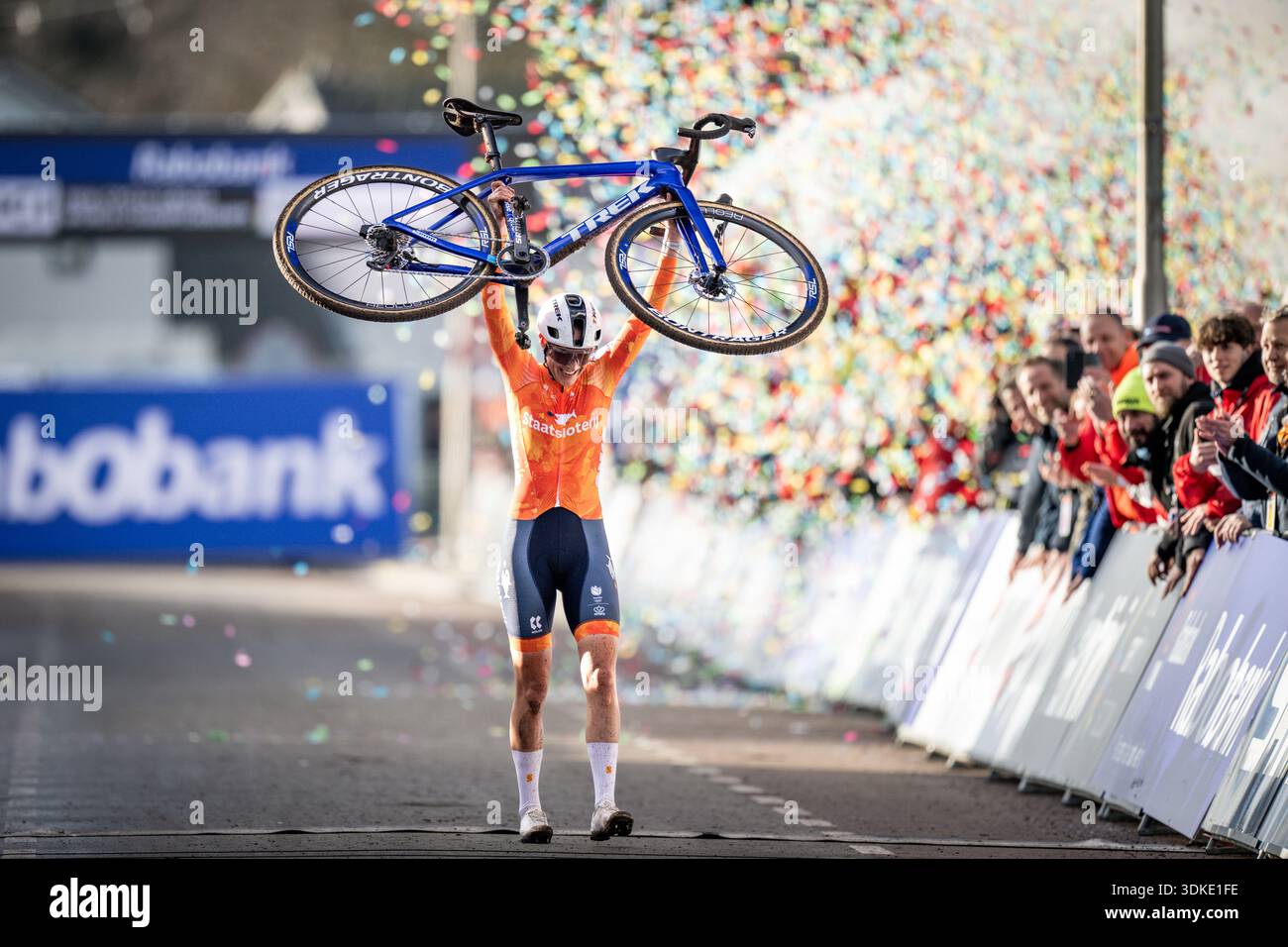 Dutch Lucinda Brand celebrates as she crosses the finish line carrying ...