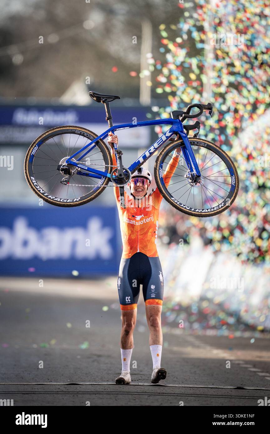Dutch Lucinda Brand celebrates as she crosses the finish line carrying ...