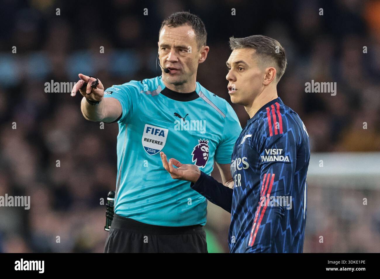 Referee Stuart Attwell instructs Leandro Trossard of Arsenal during the ...