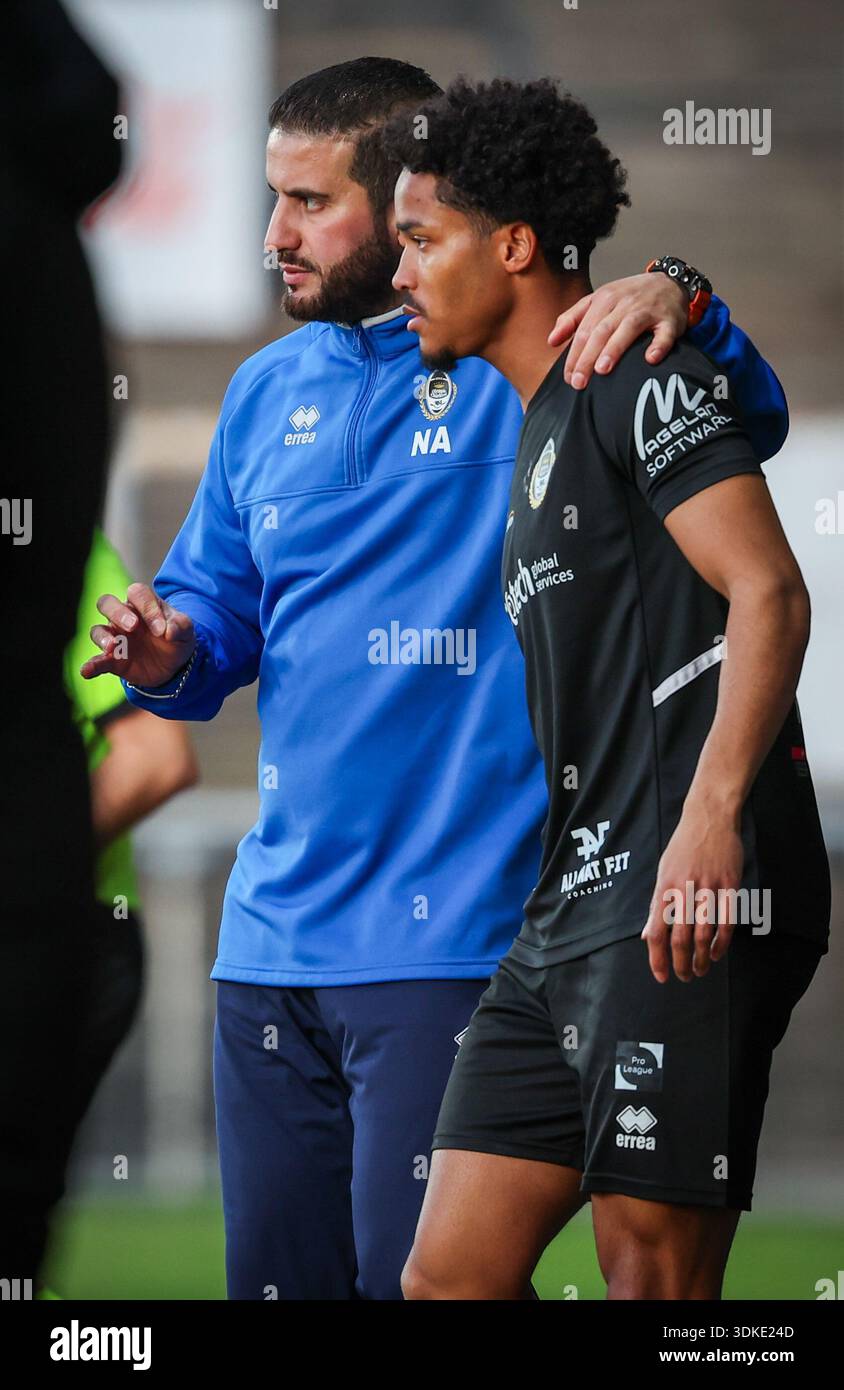 Olympic's head coach Nadjib Abdelli and Olympic's Bradley Bettinger ...