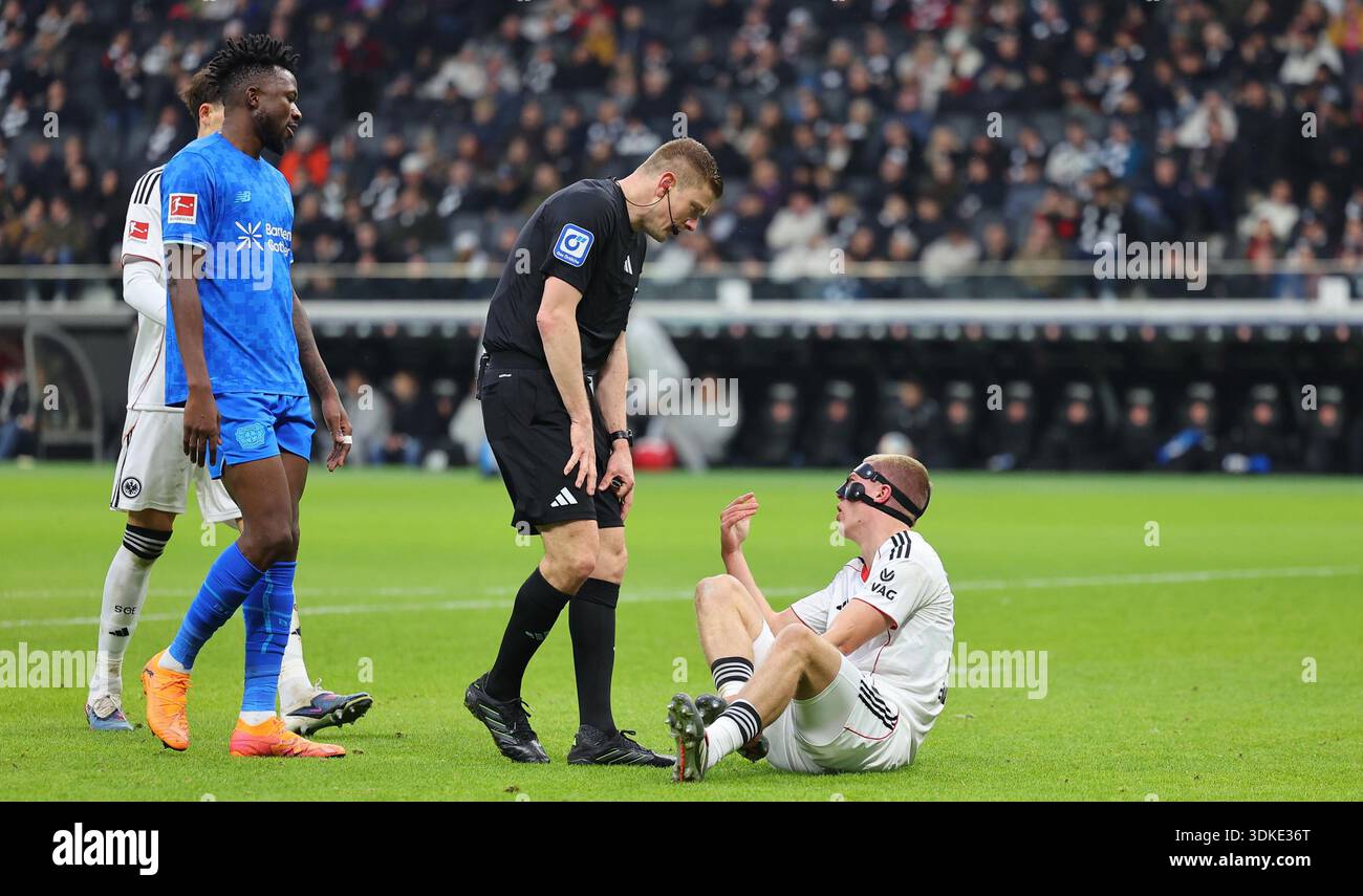 from left: Edmond Tapsoba, referee Robert Schroeder, Rasmus Kristensen ...