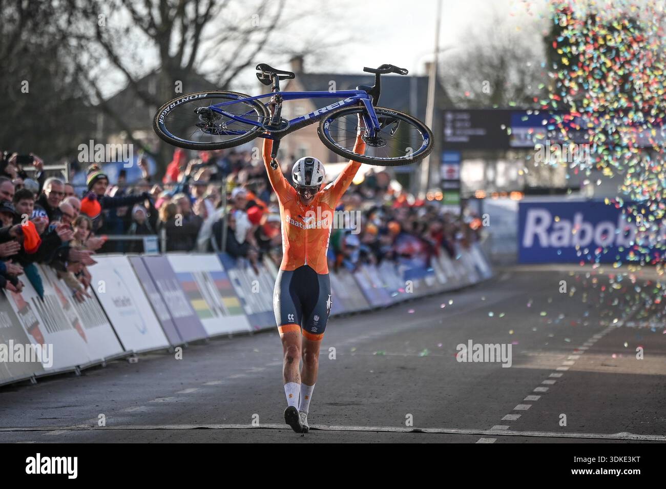 Dutch Lucinda Brand celebrates as she crosses the finish line carrying ...