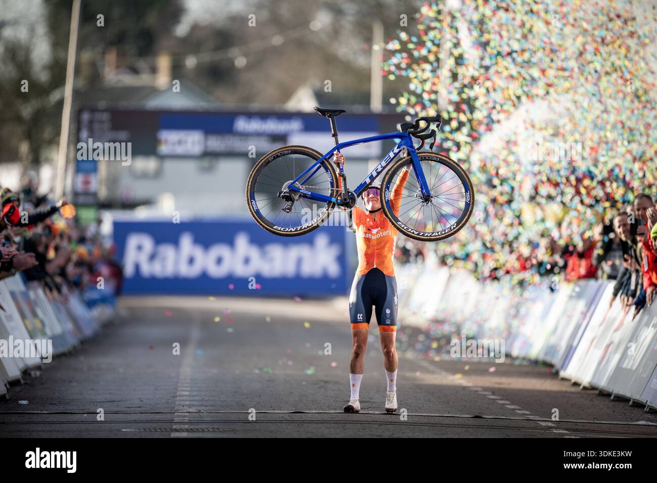 Dutch Lucinda Brand celebrates as she crosses the finish line carrying ...