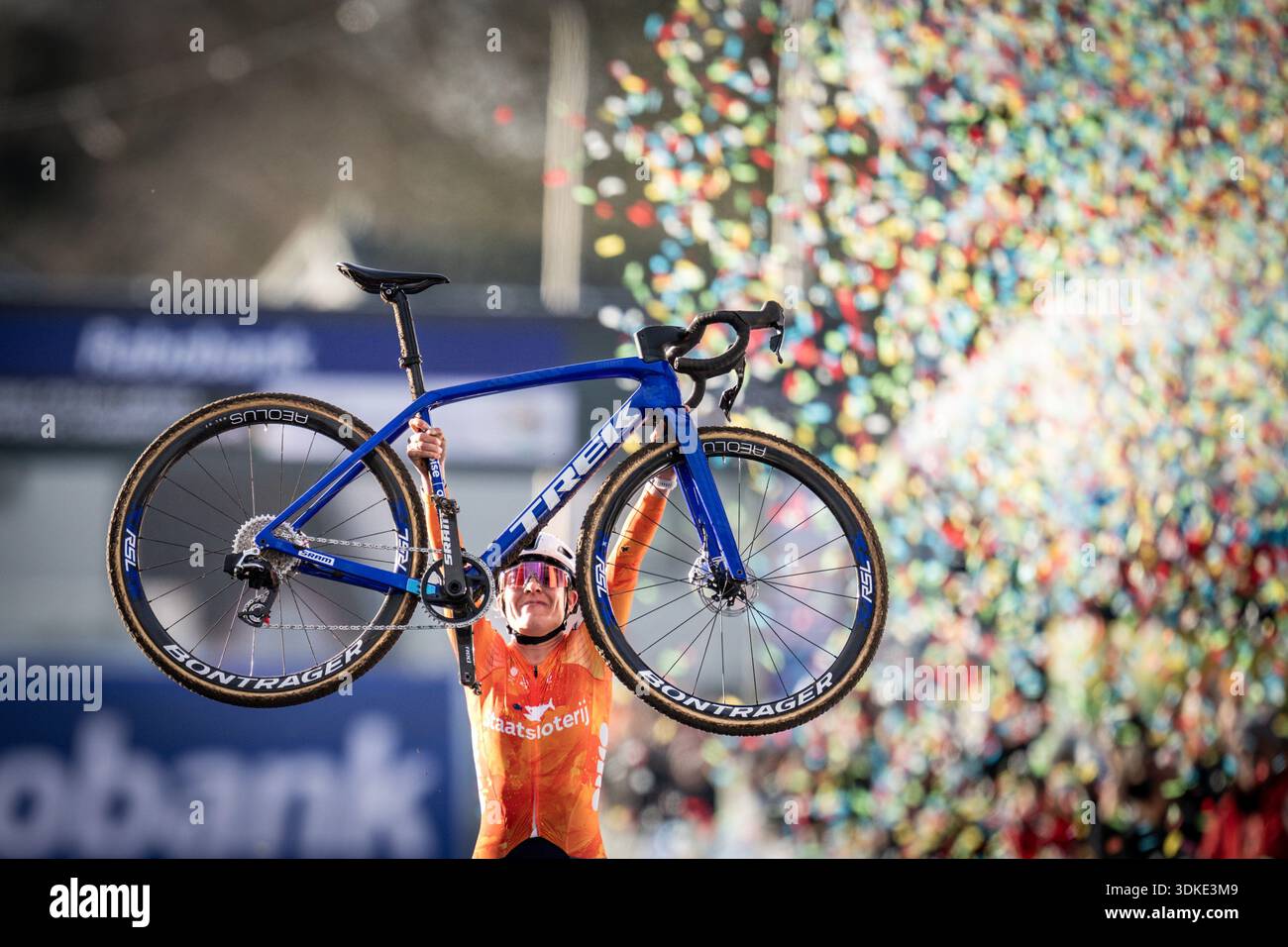 Dutch Lucinda Brand celebrates as she crosses the finish line carrying ...