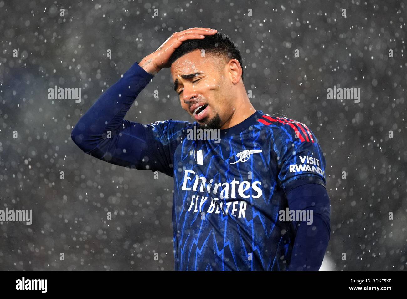 Arsenal's Gabriel Jesus reacts as the rain falls during the Premier ...