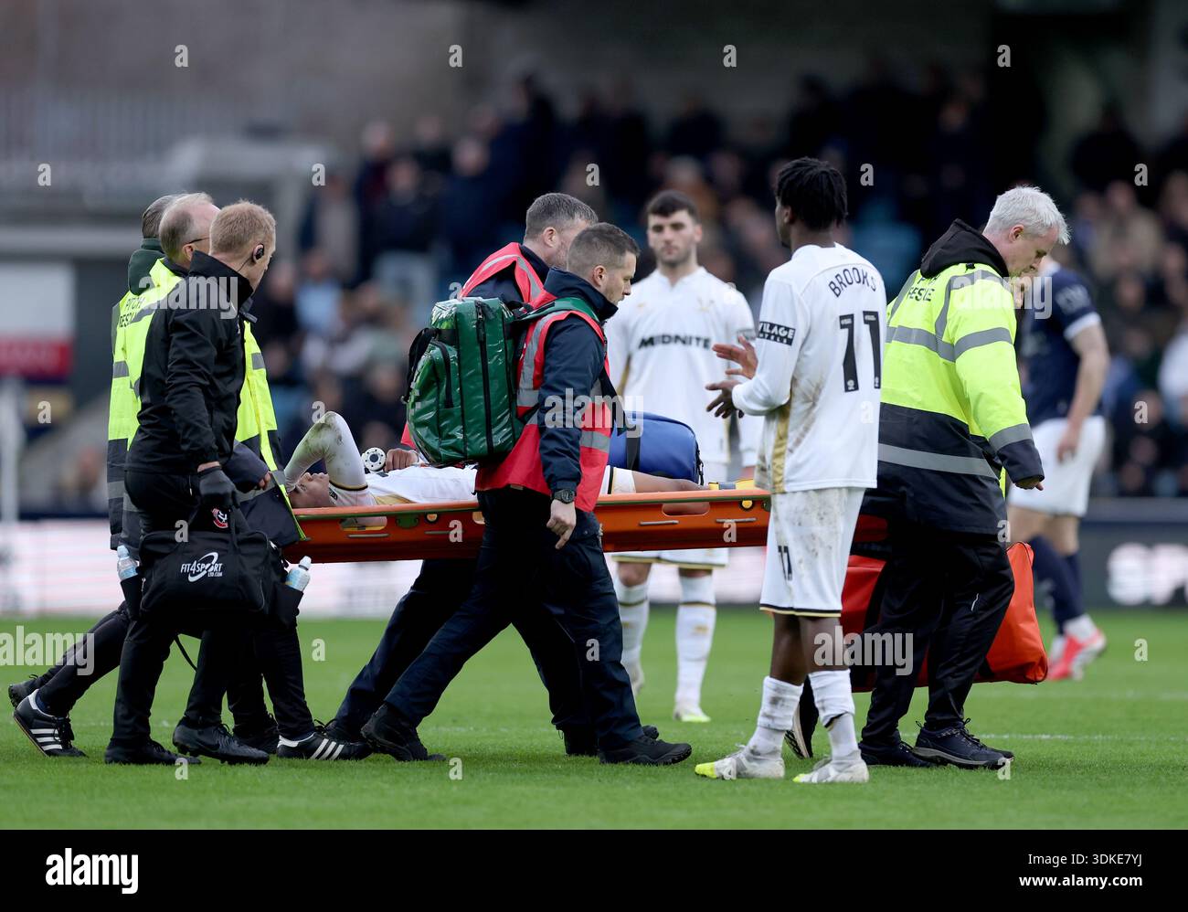 Sheffield United's Sam McCallum is carried off the pitch on a stretcher ...