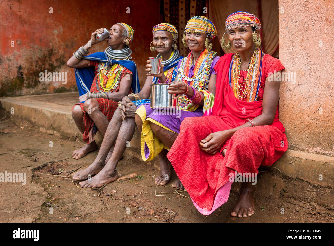 Portrait of women from the Bonda tribe drinking traditional alcoholic ...