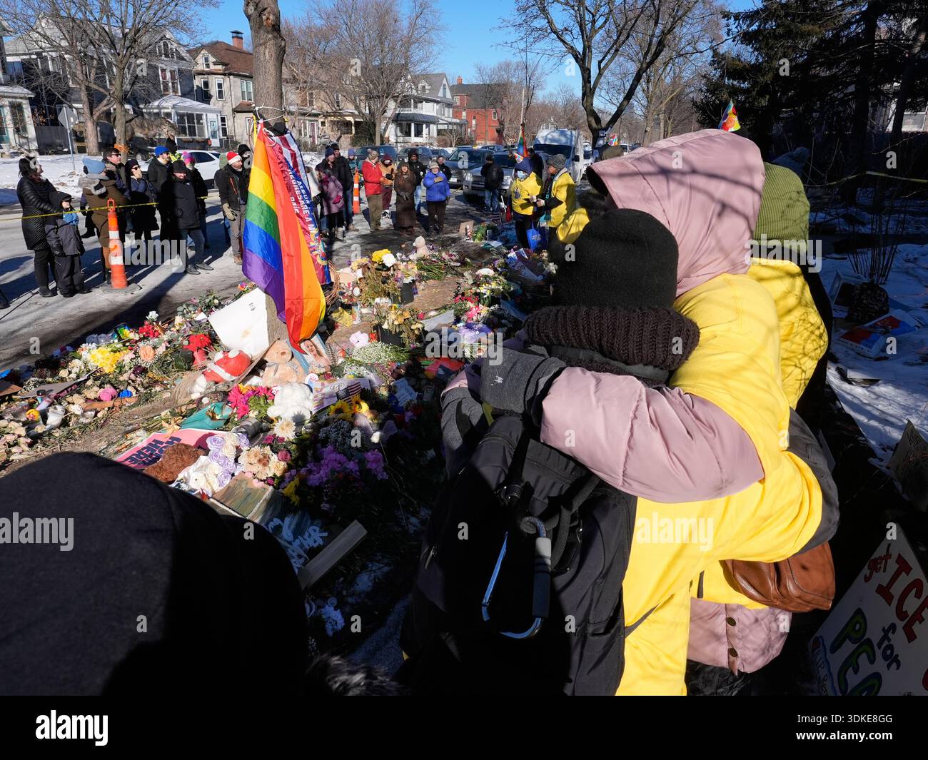 People gather around a memorial site for Renee Good on Saturday, Jan ...