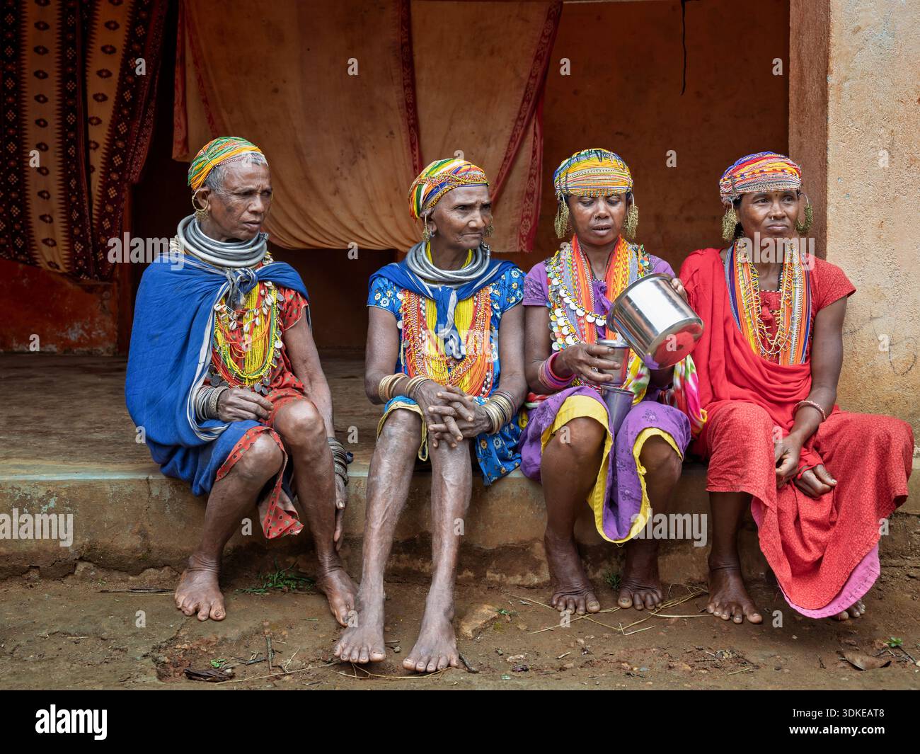 Portrait of women from the Bonda tribe drinking traditional alcoholic ...
