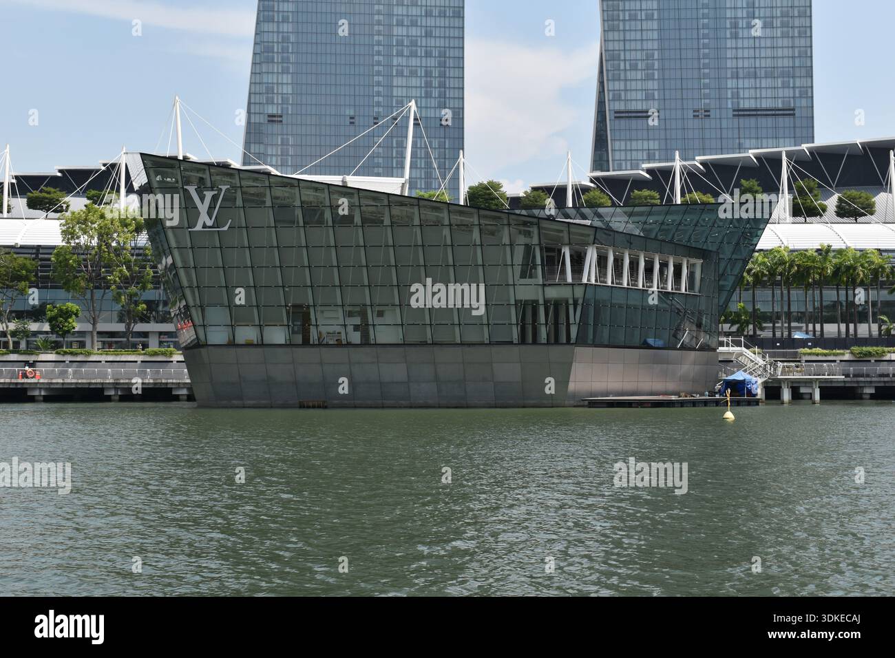 LV, Louis Vuitton Building with towers of Maina Bay Sands Hotel behind ...