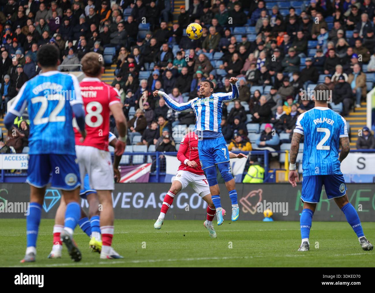 Yan Valery of Sheffield Wednesday jumps up to win the high ball during ...