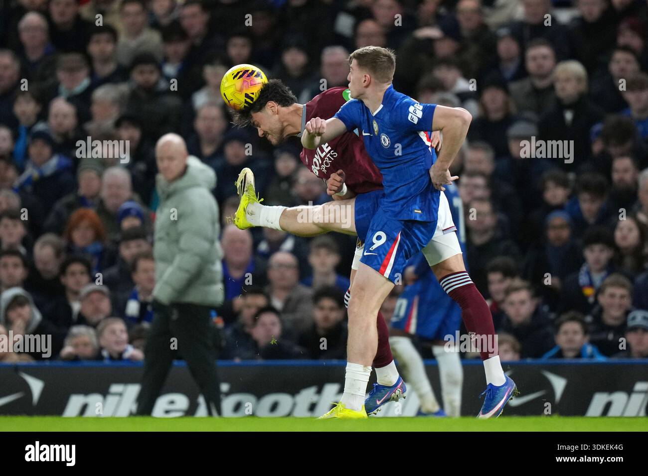 Chelsea's Liam Delap, right, fights for the ball with West Ham's ...
