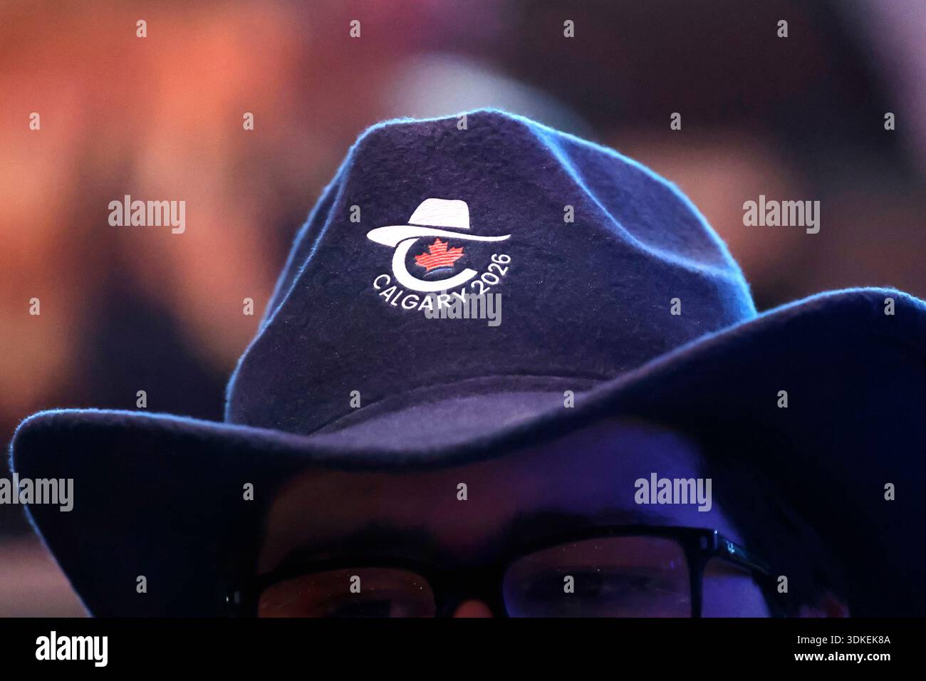 A delegate wears a cowboy hat with a Conservative Party convention logo ...