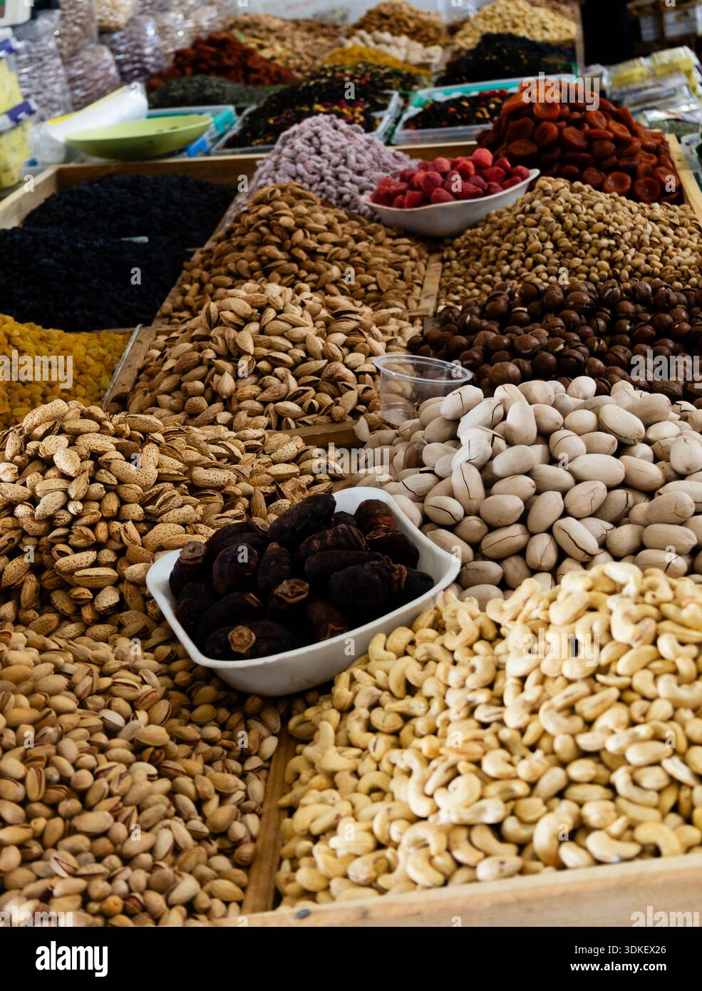 Various types of nuts—pecans, almonds, pistachios, and cashews—on ...