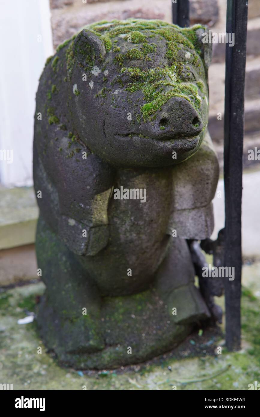 Stone pig hugging legs hi-res stock photography and images - Alamy