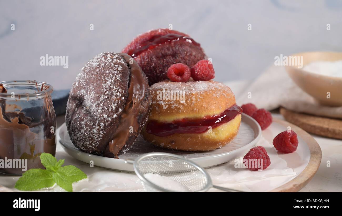 Delicious yeast doughnuts dusted with granulated sugar, overflowing ...