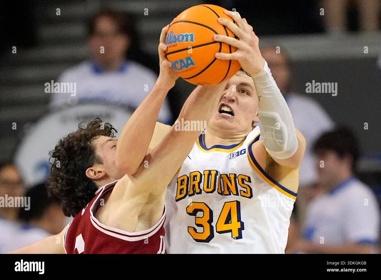 Indiana guard Conor Enright, left, and UCLA forward Tyler Bilodeau ...
