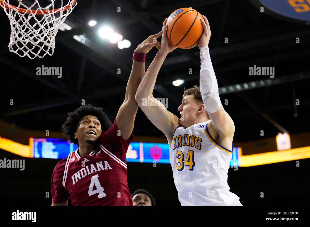UCLA forward Tyler Bilodeau, right, grabs a rebound away from Indiana ...