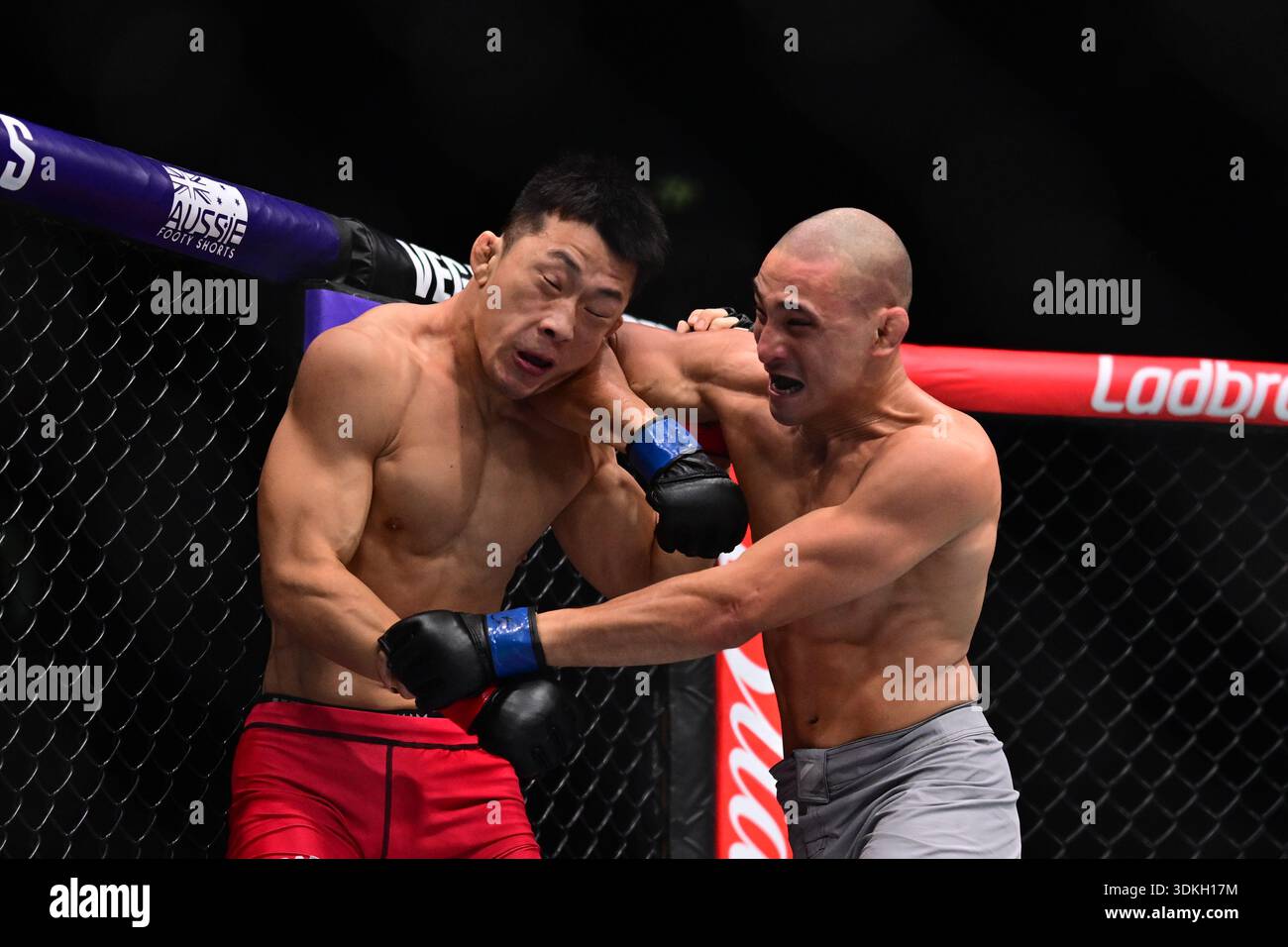 Dom Mar Fan (grey shorts) of Australia during his Lightweigh bout ...