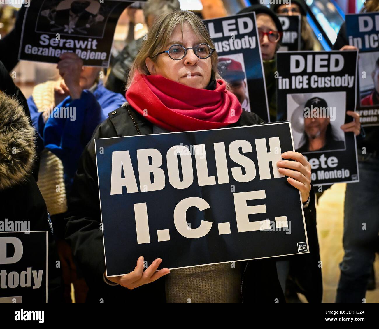 Holding up posters with the images of victims who were killed by ...