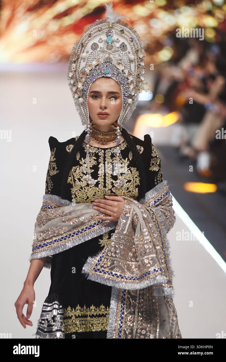 A model presents a creation by a Pakistani designer during LAAM Fashion ...