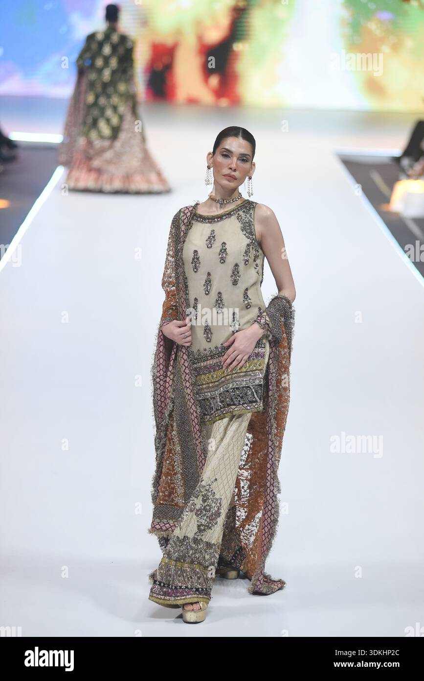 A model presents a creation by a Pakistani designer during LAAM Fashion ...