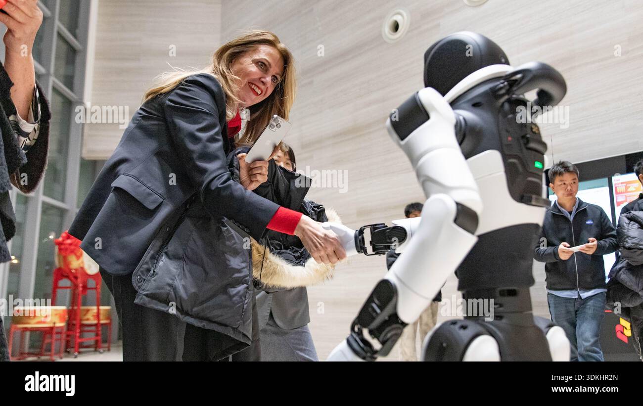 Belgrade, Serbia. 30th Jan, 2026. A visitor interacts with a humanoid ...