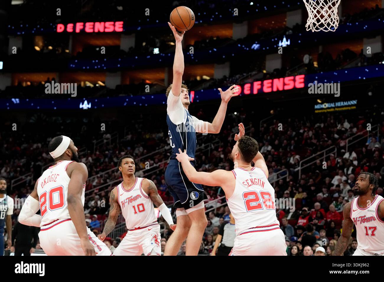 Dallas Mavericks forward Cooper Flagg, center, shoots as Houston ...