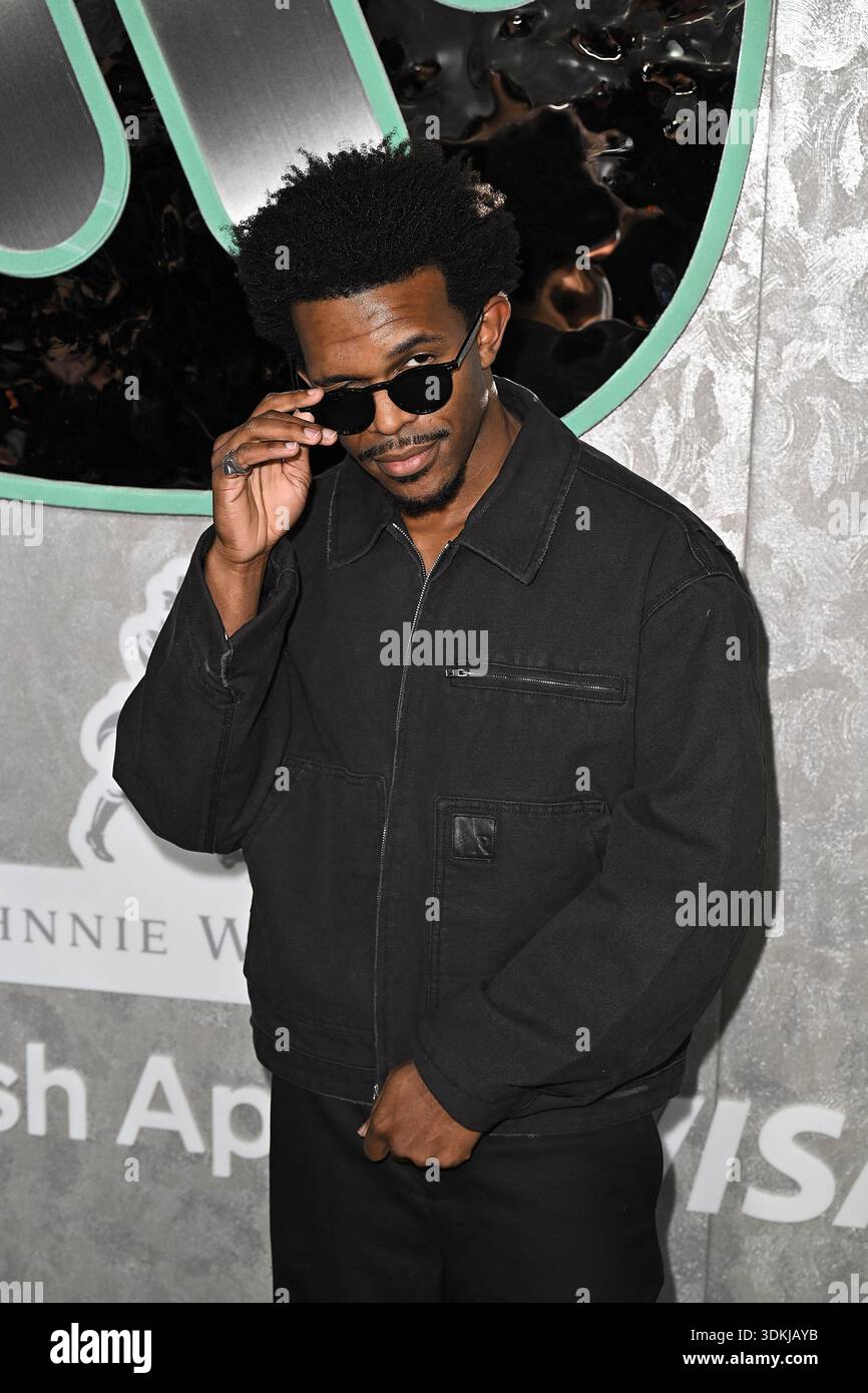 Camrus Johnson attends the Warner Music Group Pre-Grammy awards party ...