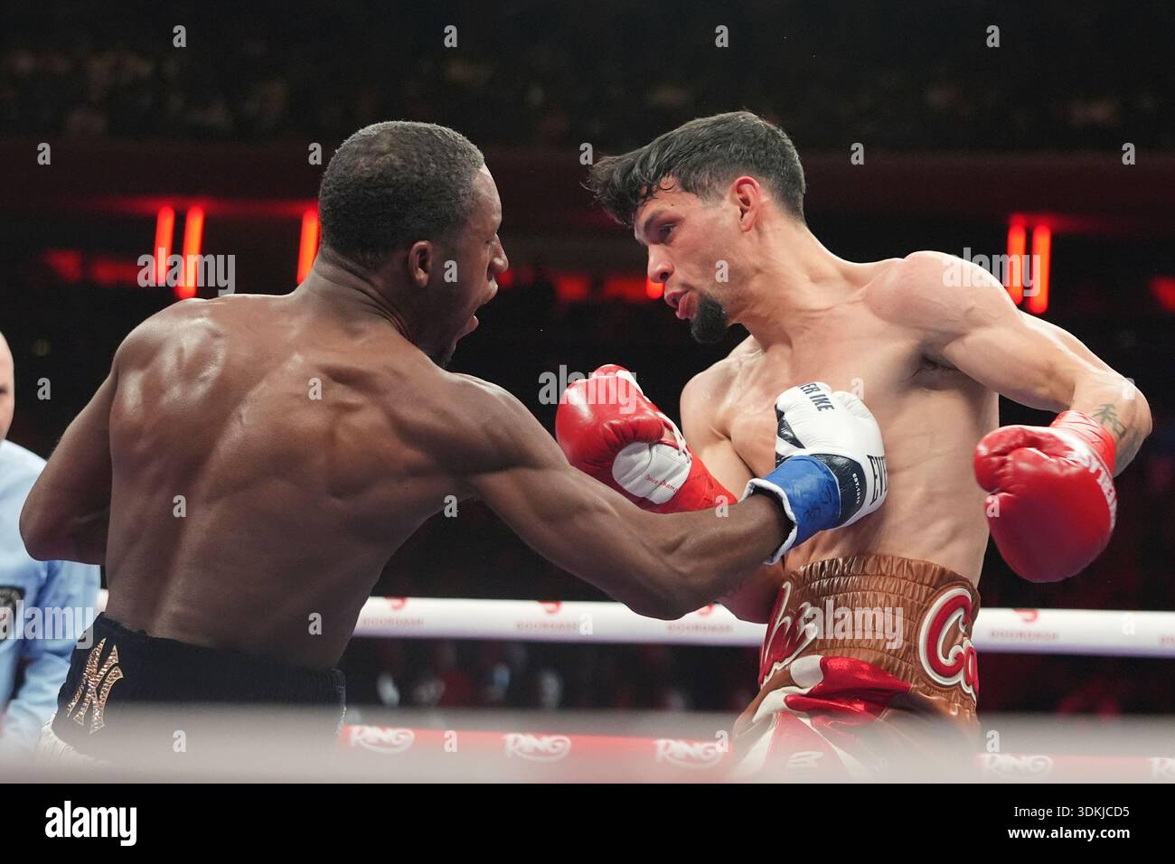 Bruce Carrington, left, lands a body shot to Carlos Castro during a ...