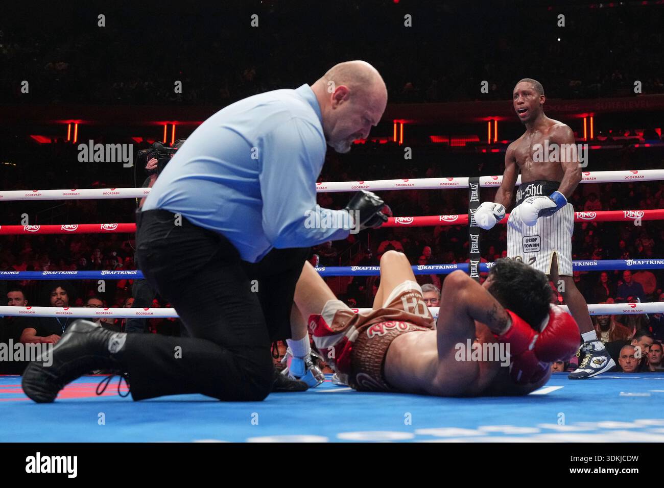 Bruce Carrington celebrates as the referee counts for Carlos Castro ...