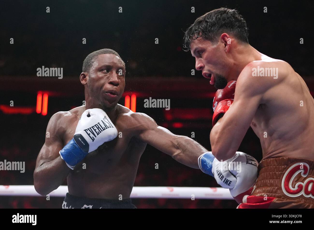 Bruce Carrington, left, punches Carlos Castro during a featherweight ...