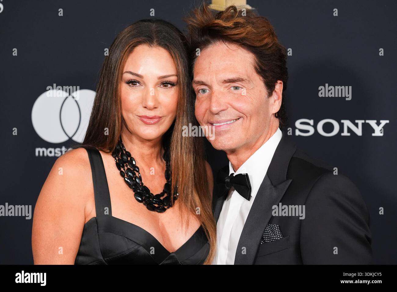 Daisy Fuentes, left, and Richard Marx arrive at the Pre-Grammy Gala on ...
