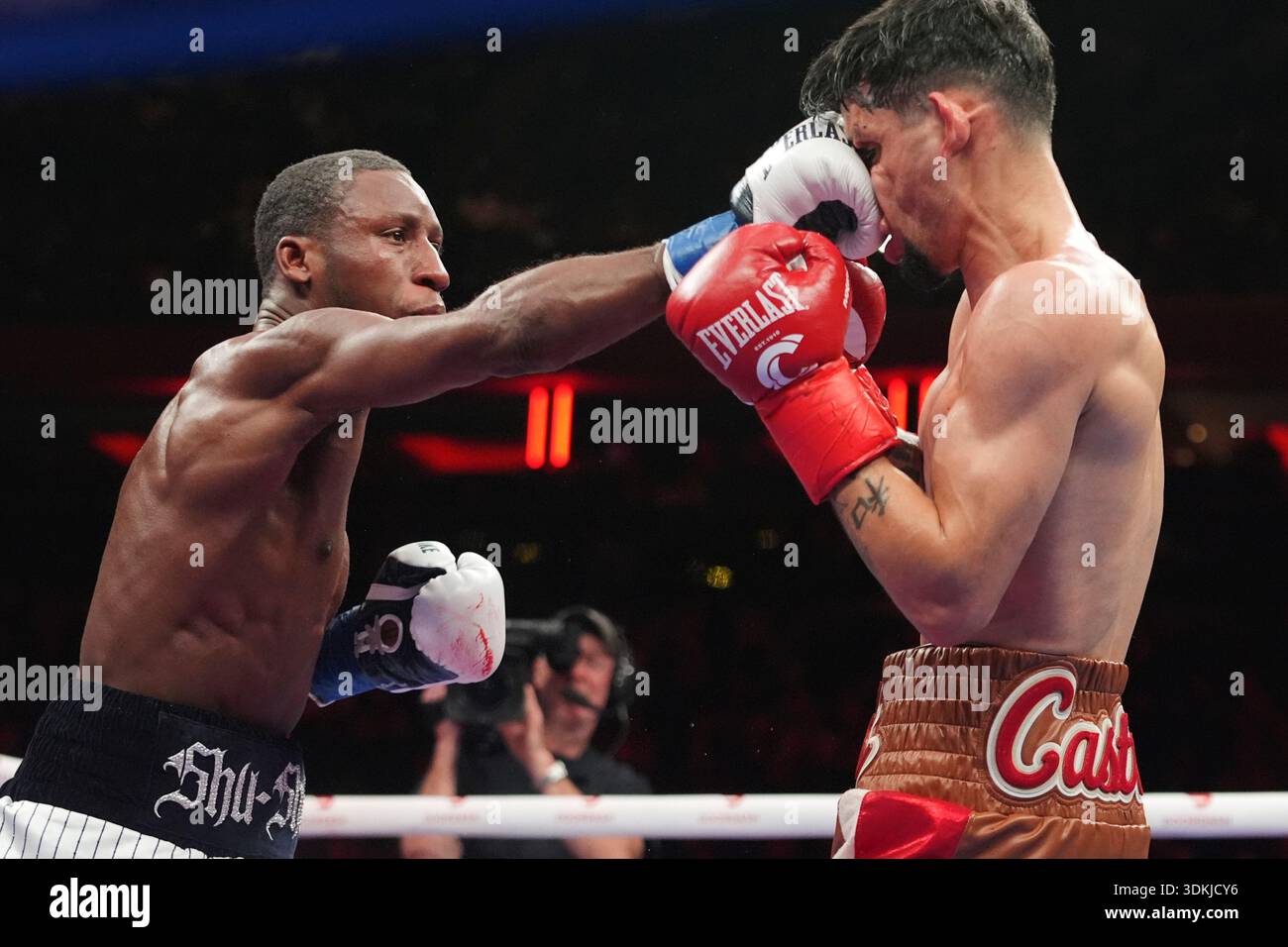 Bruce Carrington, left, punches Carlos Castro during a featherweight ...