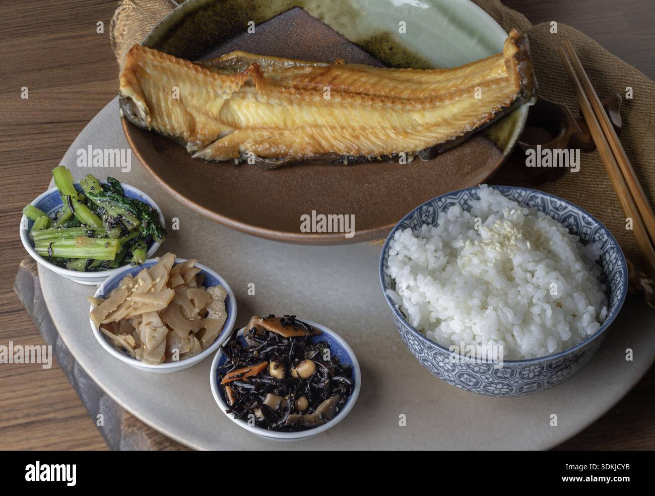A traditional Japanese teishoku set meal features a large, golden-brown ...