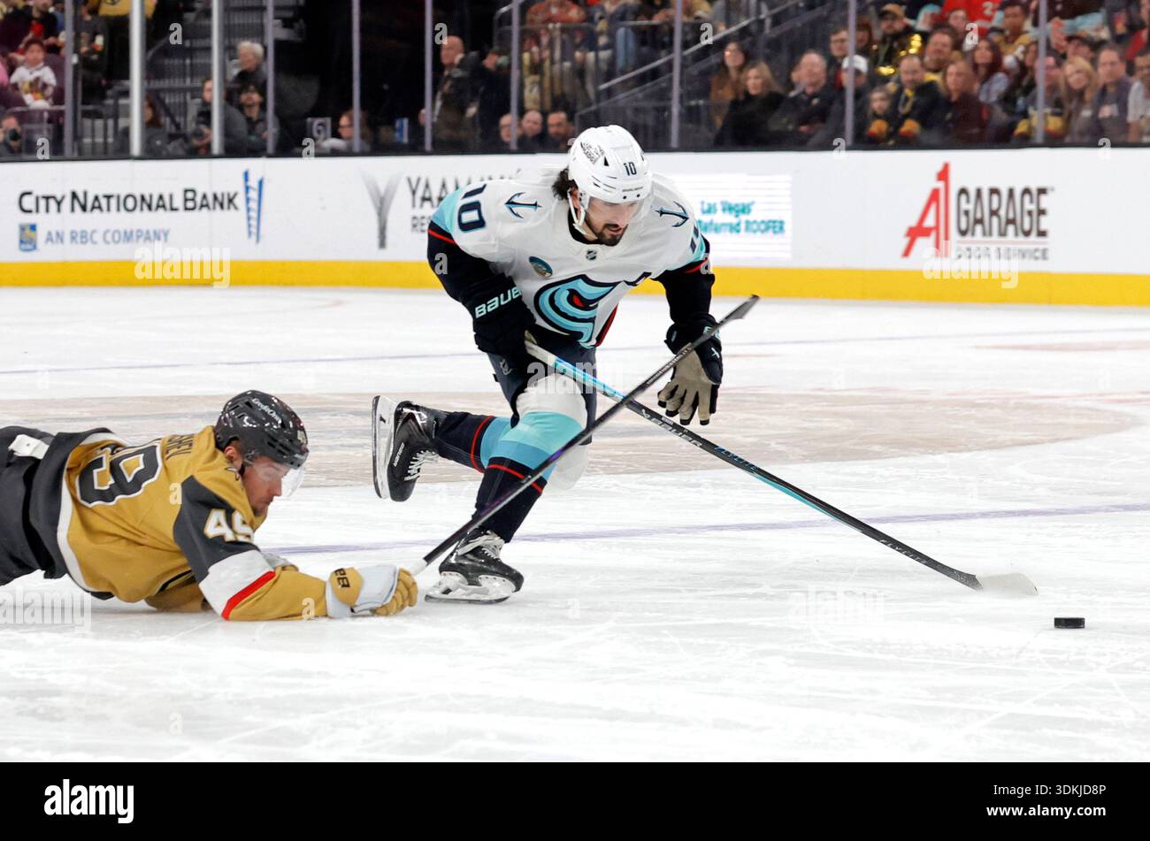 Seattle Kraken center Matty Beniers (10) takes the puck past Vegas ...