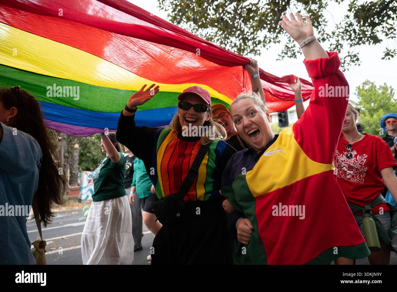 Participants march while holding a pride flag during the annual ...